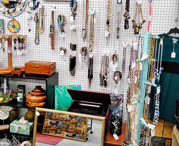 Vintage jewelry dangles alongside wooden treasures, proving one person's attic is another's shopping paradise.