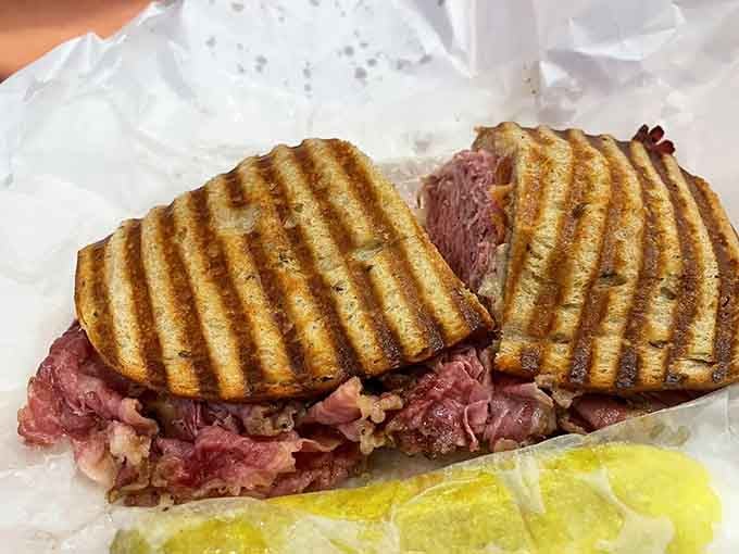 That pastrami is piled thick enough to make a New York deli jealous, pressed to golden perfection on both sides.