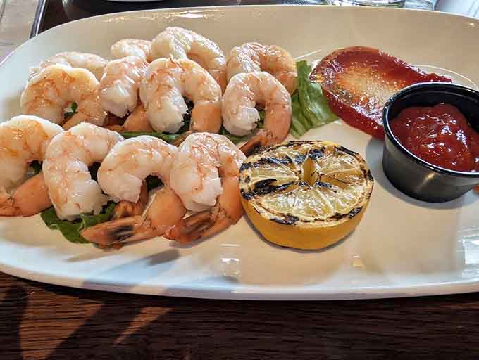 Shrimp cocktail done right: plump, fresh, and arranged like they're posing for their close-up before your fork arrives.