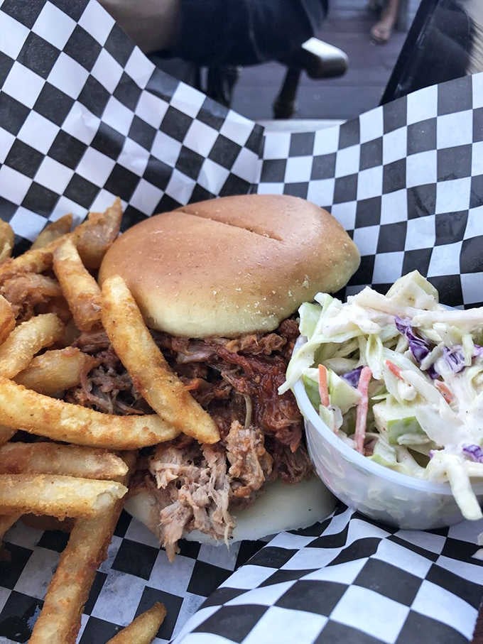 This pulled pork sandwich towers like Jerome itself, defying gravity and common sense in the best possible way.