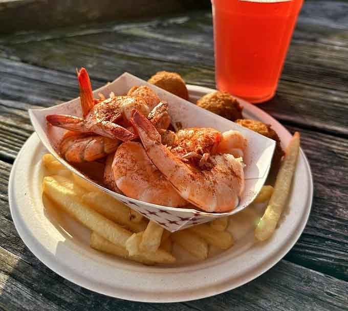 Plump, perfectly seasoned shrimp served with fries and hush puppies, because sometimes the simplest presentations are the most satisfying of all.