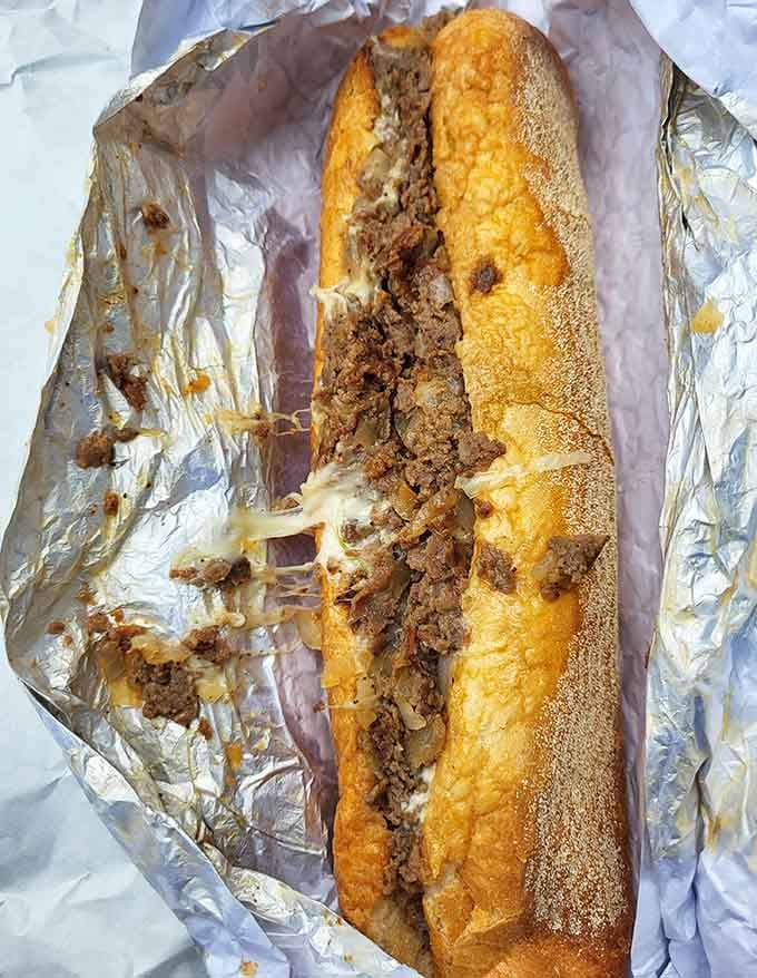 This cheesesteak means business, stuffed generously and wrapped tight like a delicious gift you give yourself without guilt.