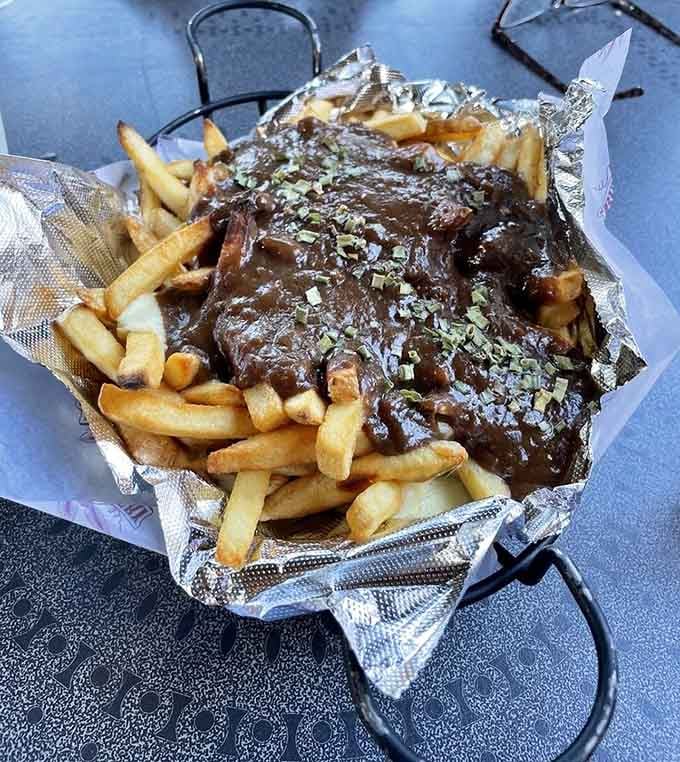 Poutine piled high with tender meat proves comfort food doesn't need to apologize for being absolutely glorious.