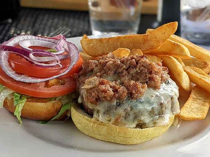 This burger comes with enough bacon to make your cardiologist schedule an intervention, totally worth it.