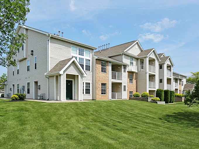 Manicured lawns and affordable apartments prove you don't need to sacrifice green space for reasonable housing costs.