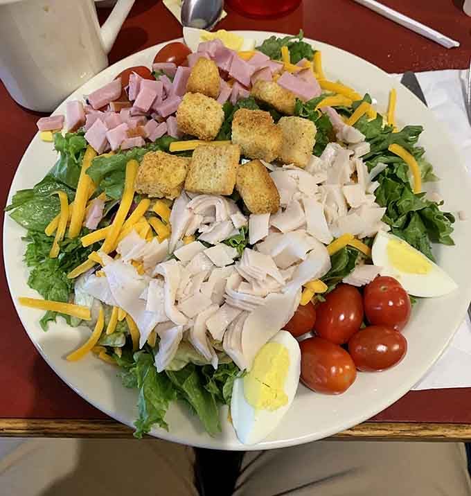 This chef salad comes loaded with ham, turkey, eggs, and croutons, making rabbit food actually look appealing.