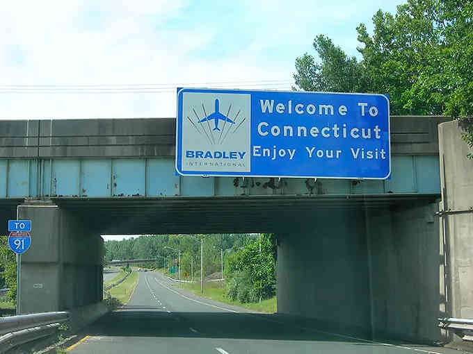 Bradley International Airport's sign reminds you that leaving Connecticut is always optional, coming back is inevitable.