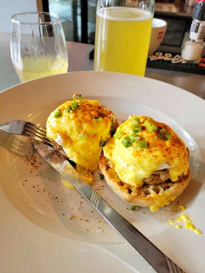 Crab cake benedict so perfectly golden, it deserves its own spotlight and possibly a standing ovation.