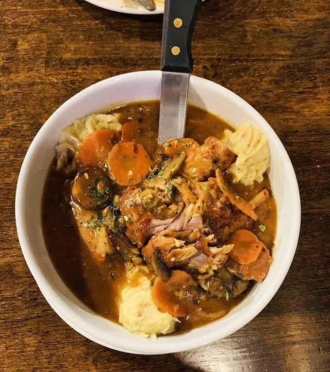 Pot roast so tender it practically apologizes for falling apart, served with vegetables that actually taste like vegetables should.