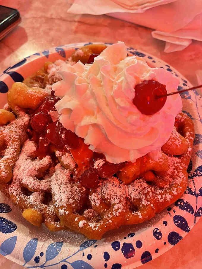 Funnel cake topped with strawberries and whipped cream: the carnival came to the diner and decided to stay.