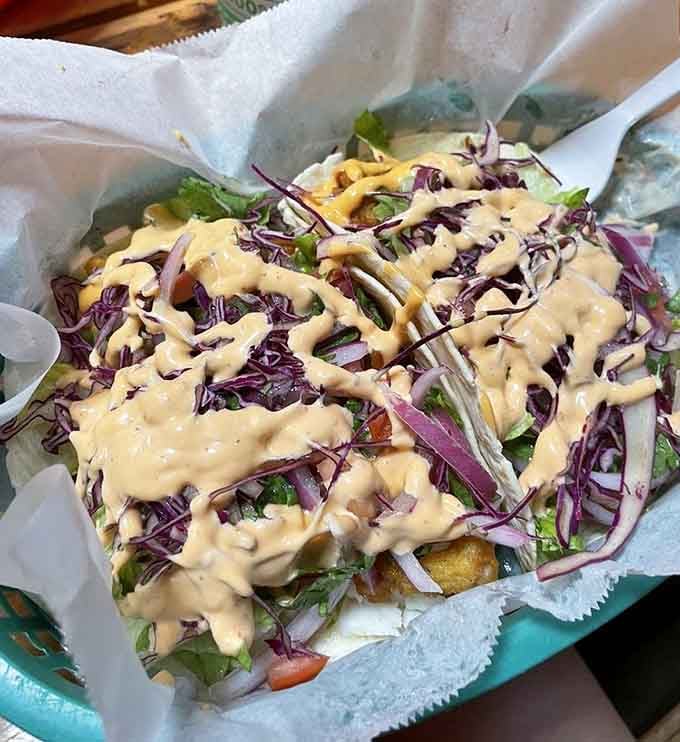 These fish tacos are dressed to impress with vibrant slaw and sauce drizzles that make every bite a flavor celebration.