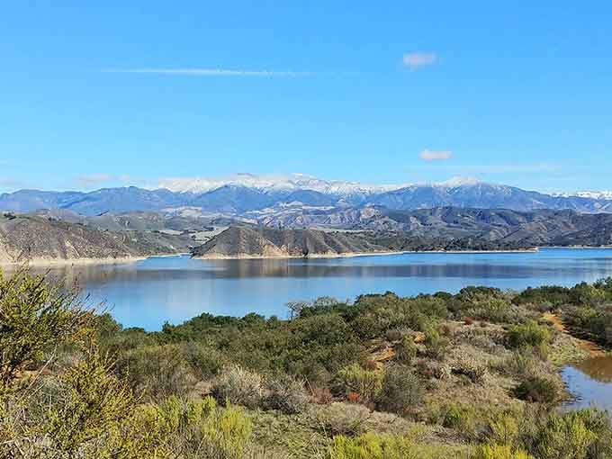 Snow-capped peaks reflect in Cachuma's mirror-smooth waters, proving California contains more seasons than people think it does.