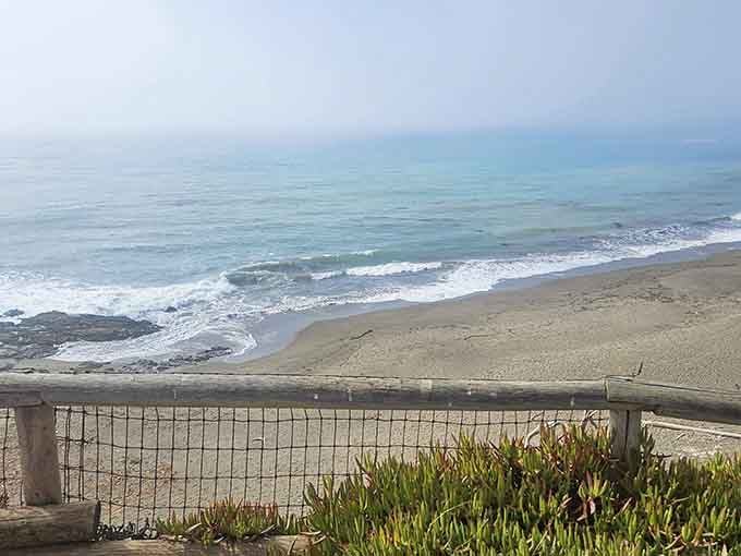 That railing has witnessed countless perfect moments where the ocean reminds you why California living beats everything else.