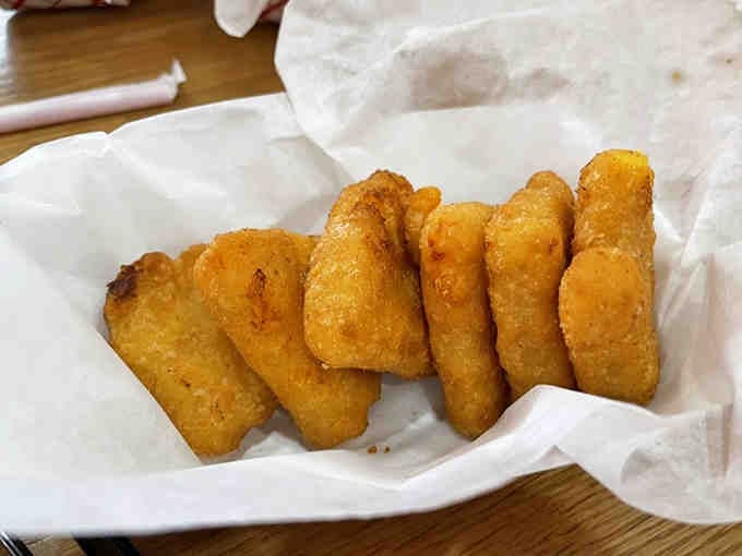 Golden, crispy mac and cheese bites that prove someone finally figured out how to improve upon perfection itself.