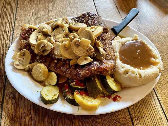 When your porterhouse steak arrives with saut&eacute;ed mushrooms cascading down like a delicious avalanche, you know someone's doing it right.