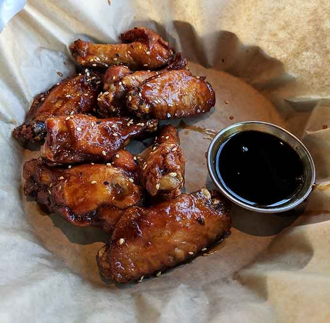 These glazed chicken wings shine like they've been polished, sticky and sweet in all the right ways.