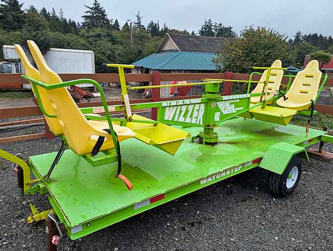 The Whizzer ride looks like someone welded lawn chairs to a flatbed and called it genius.