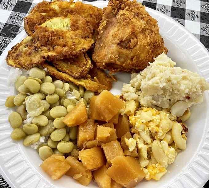 Fried chicken, lima beans, stewed tomatoes, and potato salad: this plate understands the assignment perfectly.