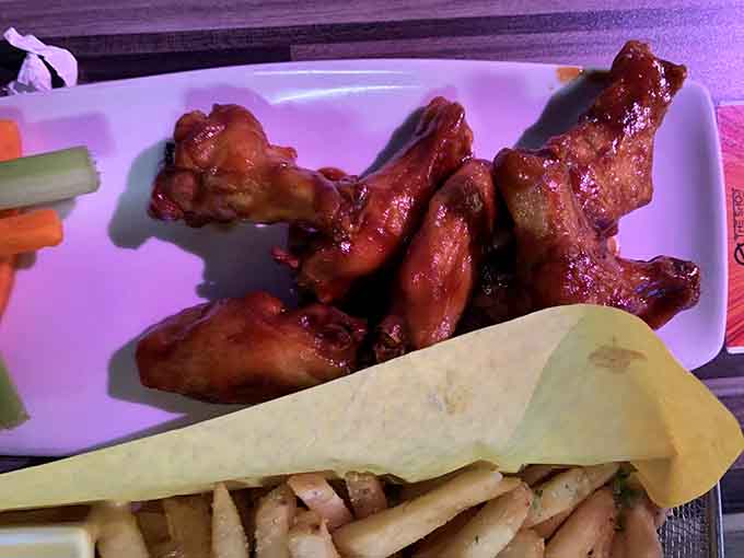 Wings and fries: the dynamic duo that's been fueling arcade champions since quarters were actually worth something.