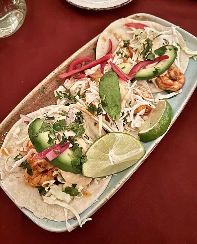 Fresh fish tacos topped with crisp cabbage and pickled onions prove simplicity wins when executed with this much care.