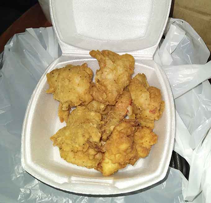 Crispy fried shrimp piled high with a baked potato, proving that generous portions never go out of style in Alabama.