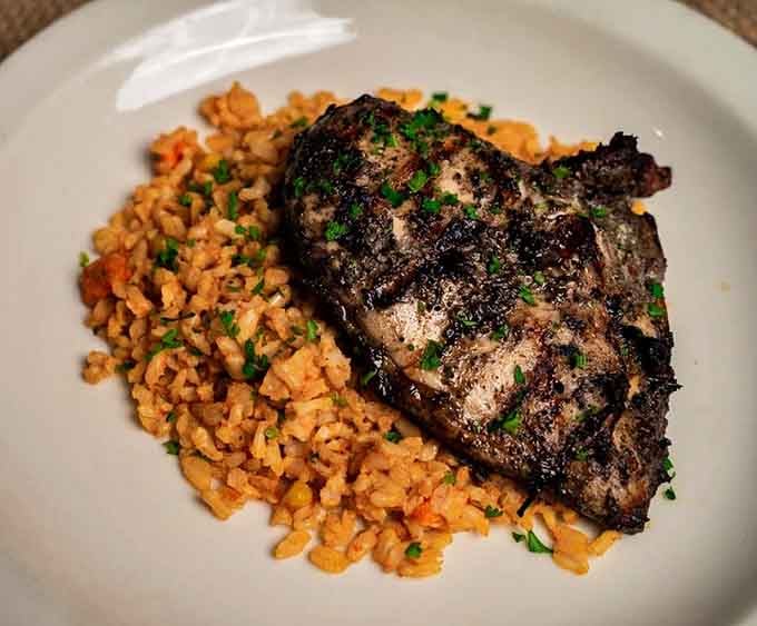 Jamaican jerk chicken paired with rice that'll transport your taste buds straight to the islands.