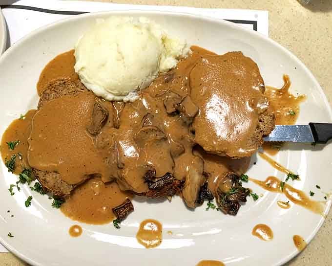 Meatloaf topped with saut&eacute;ed mushrooms and mashed potatoes, because sometimes you need carbs supporting your carbs.