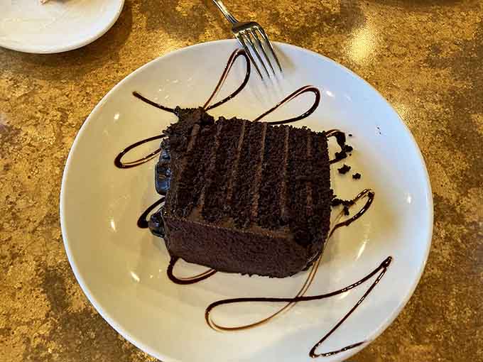 This chocolate cake stands tall and proud, like it knows exactly how good it is and isn't apologizing.