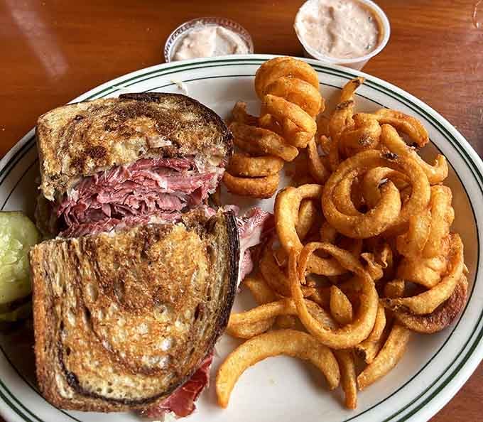 That Reuben sandwich with homemade onion rings proves some combinations are simply meant to be together forever.