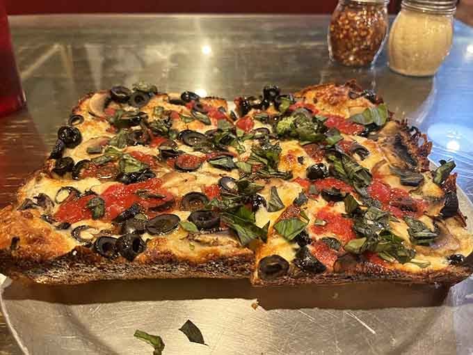 Mushrooms, black olives, and fresh basil prove that vegetable-forward pizzas can be just as crave-worthy as their meaty cousins.