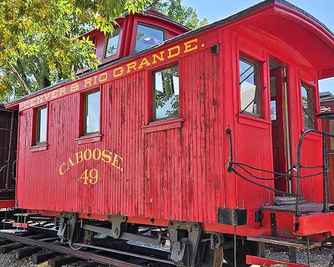 The bright red Denver & Rio Grande caboose practically glows with history and countless miles traveled.