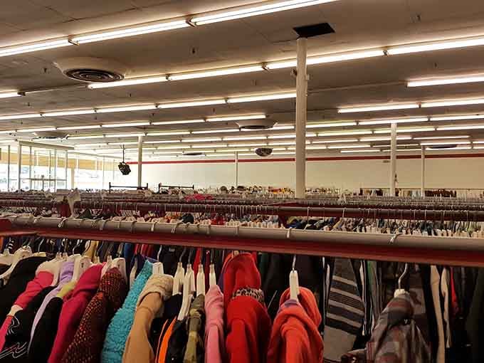 Rows of clothing stretch endlessly like a fabric rainbow &ndash; somewhere in there is your next favorite outfit.