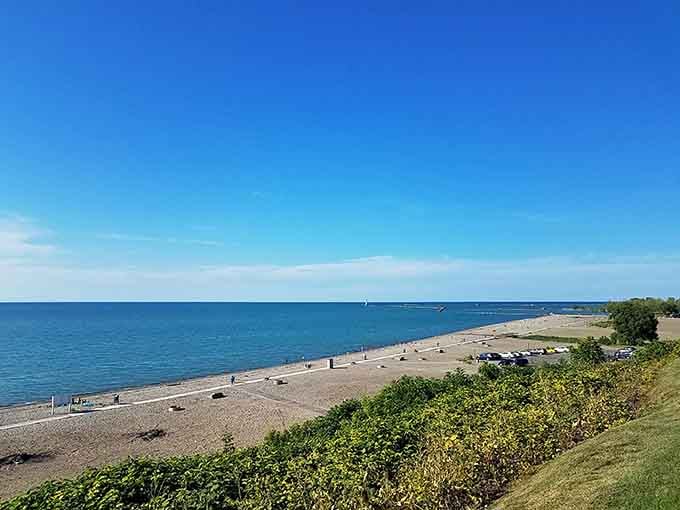Lake Erie stretches endlessly blue, offering free waterfront views that coastal properties charge thousands monthly just to glimpse.