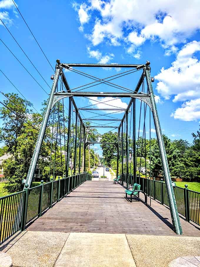 This charming pedestrian bridge connects more than just streets; it links past and present with graceful steel arches.