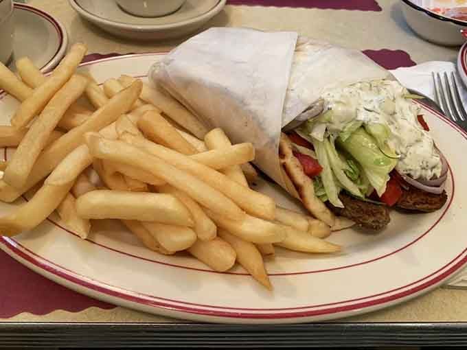 That gyro loaded with fresh toppings and nestled beside a mountain of fries knows exactly what you need.