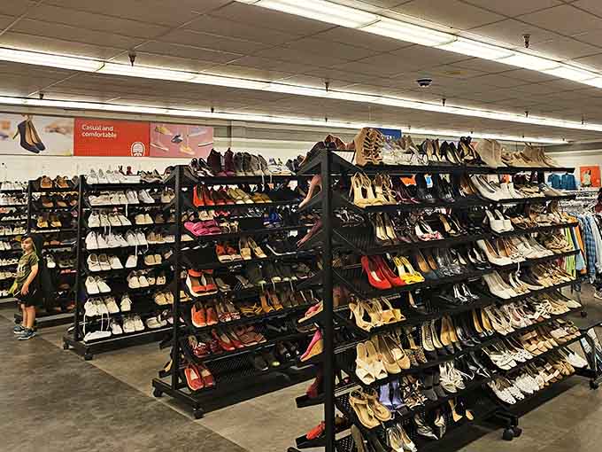 Rows of shoes in every style imaginable, because someone's wedding heels deserve a second chance at happiness.