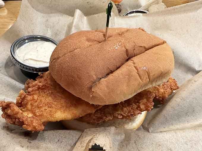 This fish sandwich on a soft bun with tartar sauce is proof that sometimes perfection doesn't need fancy presentation.