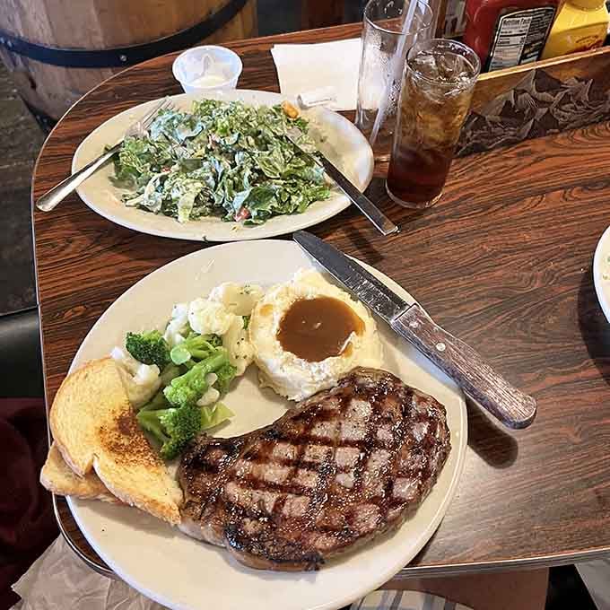 A beautifully charred steak paired with fresh salad creates the kind of balanced meal that would make even the toughest gunslinger feel virtuous about their dining choices.