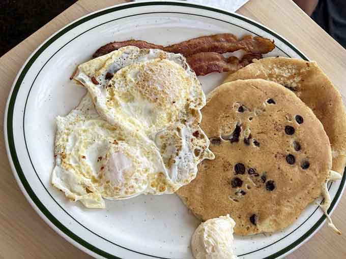 Chocolate chip pancakes with bacon and eggs: because adulting means you can have dessert for breakfast now.