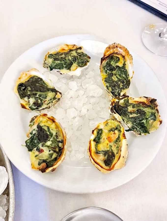 Oysters Rockefeller so legendary they deserve their own historical marker somewhere between the boardwalk and culinary immortality.