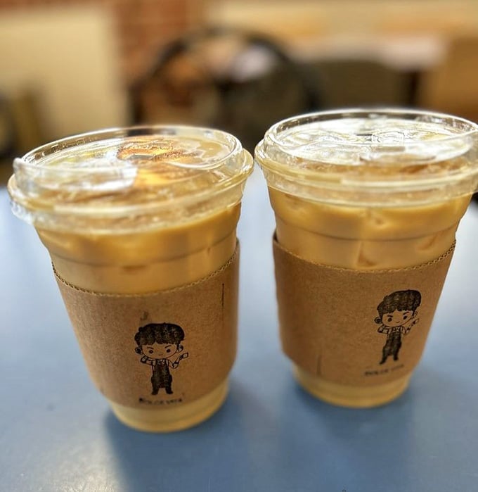 Two iced vanilla lattes looking like they're about to make someone's day infinitely better, one sip at a time.