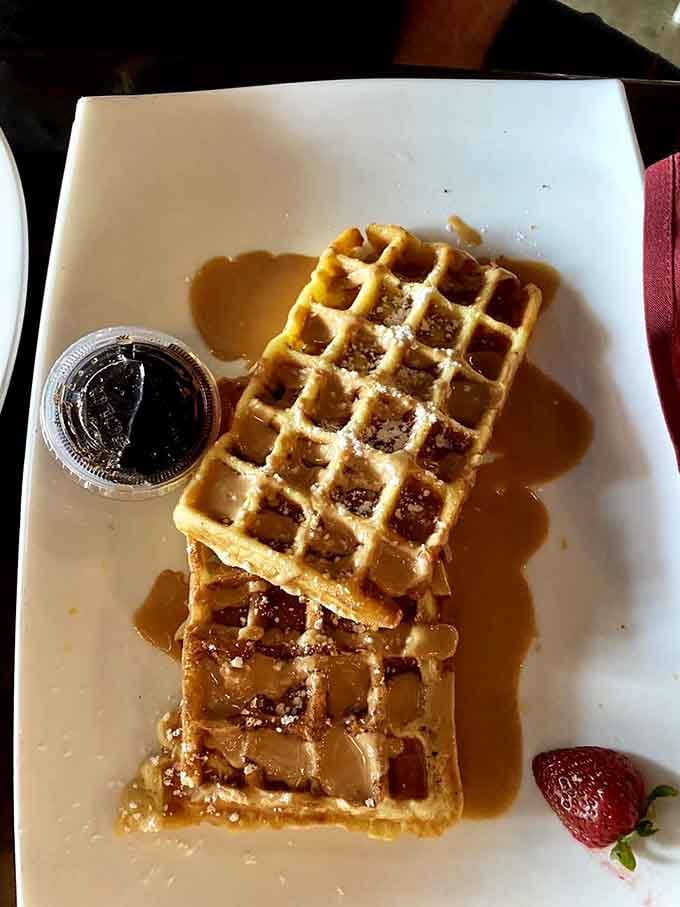 Golden waffles stacked like edible architecture, ready to make your Tuesday feel like a special occasion.