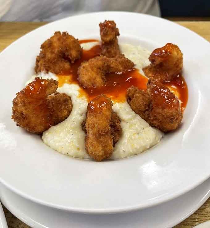 Shrimp and grits topped with what appears to be fried perfection, because sometimes breakfast needs to be fancy and comforting simultaneously.