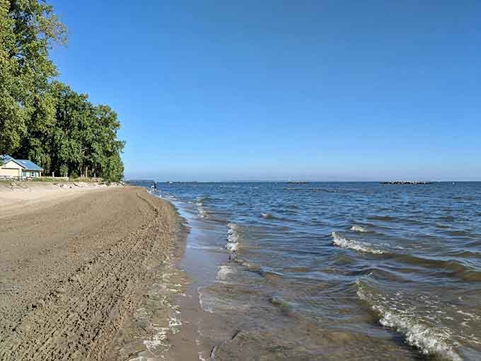 Gentle waves lapping at sandy shores, proving paradise doesn't require a passport or tropical temperatures at all.