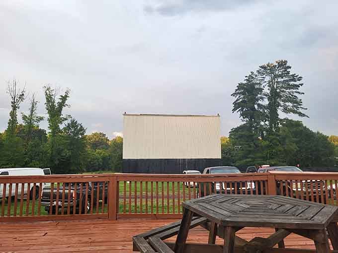 The Eden Drive-In's blank screen awaits twilight magic, a nostalgic throwback that's somehow still standing strong.