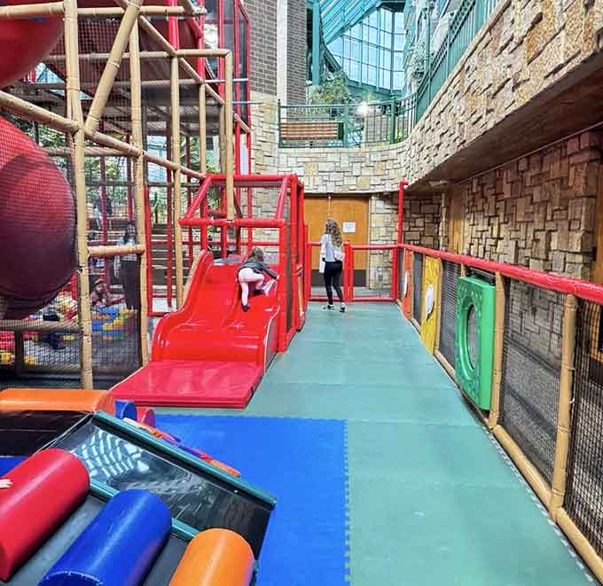 The toddler zone: where giant foam blocks create architectural masterpieces that would make Frank Lloyd Wright weep with joy.