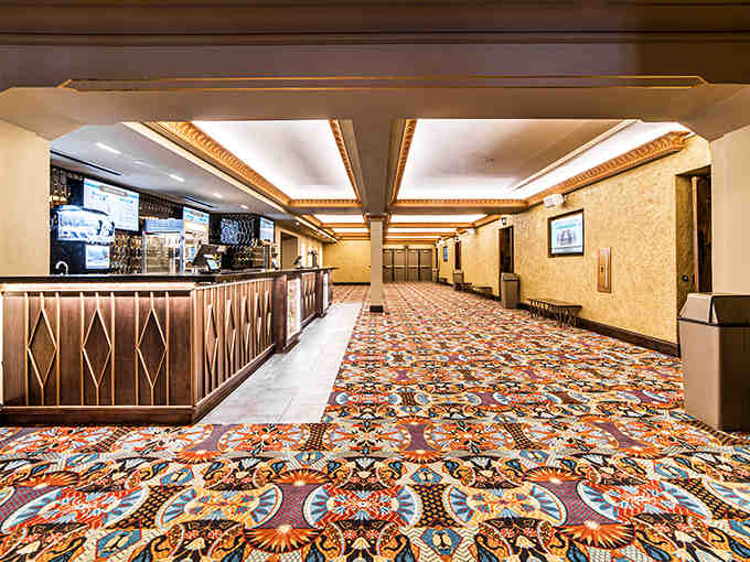 The concession stand gleams with Art Deco charm, promising popcorn served with a side of history.