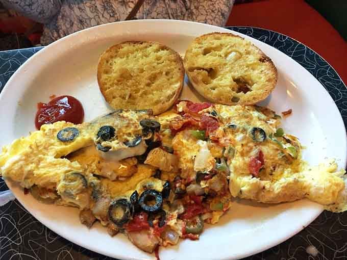 This loaded omelet with English muffins shows that vegetables can be delicious when surrounded by cheese and eggs.