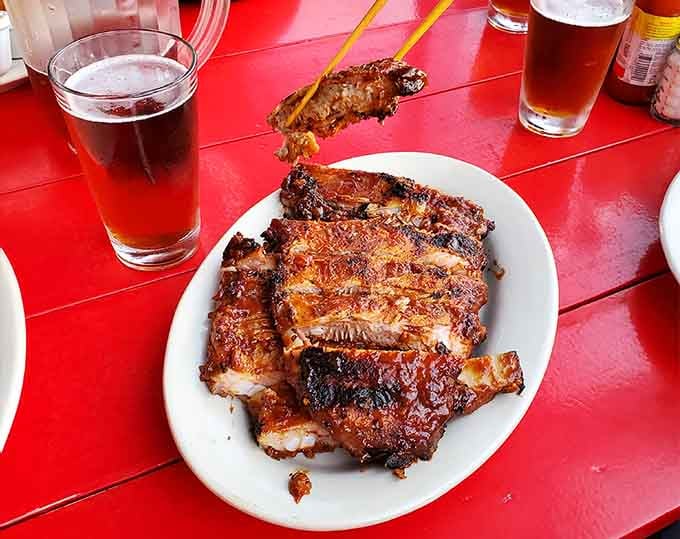Cold beer and hot ribs, proving that some combinations are simply too perfect to mess with.