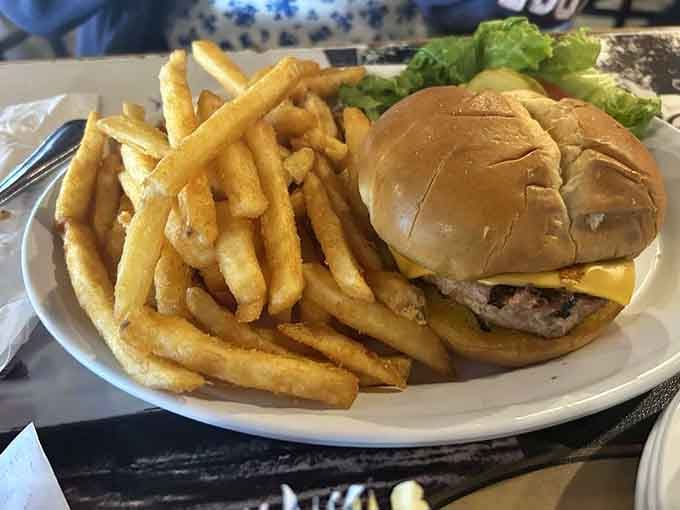 A turkey burger with fries proving that healthier choices don't have to mean smaller portions or less satisfaction.